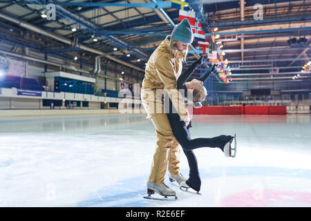 Coach Teaching Girl Figure Skating Stock Photo - Alamy