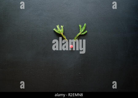 Christmas deer from tree branches and berry on whiteboard Stock Photo ...