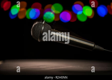 Mic Drop! A microphone falling onto a stage floor Stock Photo - Alamy