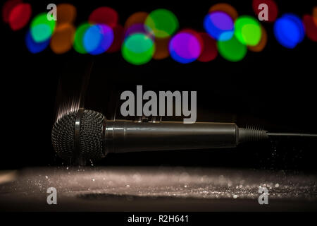 Mic Drop! A microphone falling onto a stage floor Stock Photo - Alamy