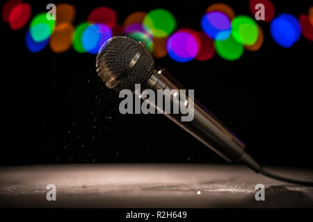 Mic Drop! A microphone falling onto a stage floor Stock Photo - Alamy