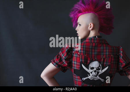 Portrait of woman with mohawk looking away Stock Photo - Alamy