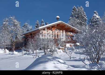 Austria, Tyrol, farm near Kitzbühel against Wilder Kaiser Stock Photo ...