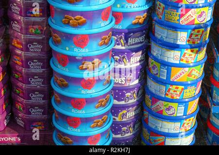 Tins of confectionery on display in a food store window Surrey England ...