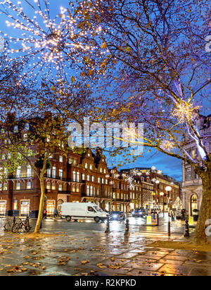 Night view of Sloane Square with Christmas light decorations and big ...