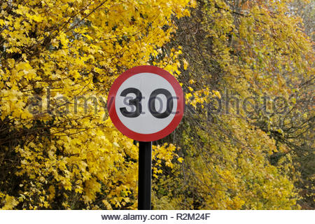 30mph maximum speed limit sign on a road in a small town in the UK ...