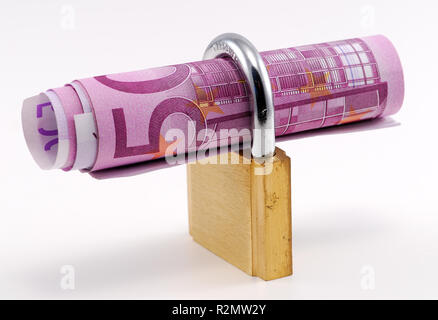 Money under lock and key Stock Photo - Alamy