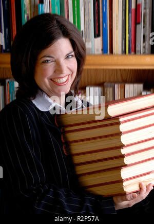 Attractive female librarian at work Stock Photo - Alamy