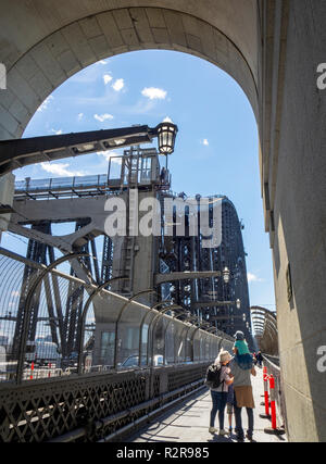 Pedestrians walking across the Sydney Harbour Bridge NSW Australia ...