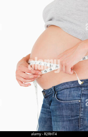 girls stomach measuring with tape isolated on white background, skiny ...