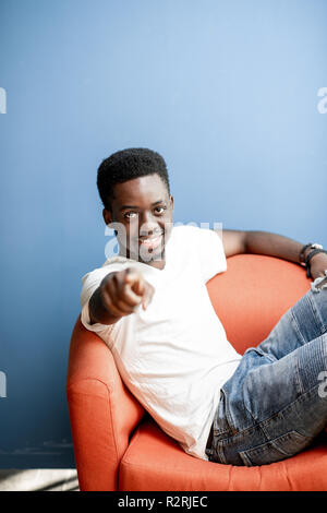 emotional man in a white t-shirt irritated facial expression pink ...