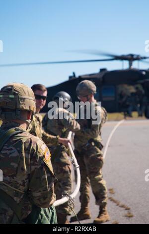 U.S. Army Ranger soldiers fast rope from a USA UH-60 Black Hawk ...