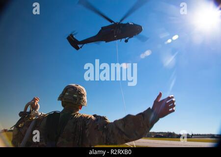 U.S. Army Ranger soldiers fast rope from a USA UH-60 Black Hawk ...
