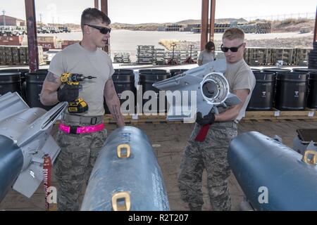 Staff Sgt. Justing Harner and Airman 1st Class Luke Johnson, munitions ...