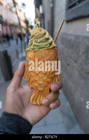 taiyaki, Green tea ice cream and mango slices served for dessert at a ...