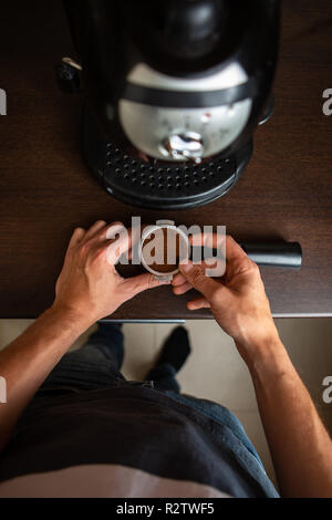 Man preparing coffee from coffeemaker Stock Photo - Alamy