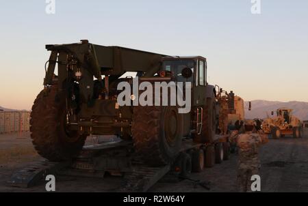 All terrain vehicle with a large trailer in a forest road in the ...