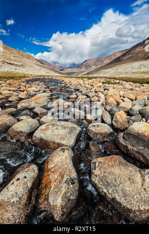 Mountain stream with stones in Himalayas Stock Photo - Alamy