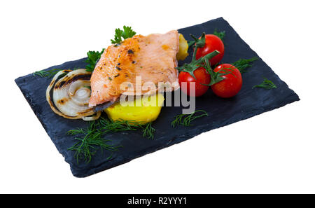 Deliciously fried trout fillets with potatoes, cherry tomatoes and ...