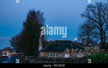 The waxing gibbous Moon appears above Earth’s horizon while the ISS ...