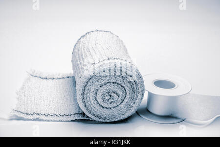 Roll of medical bandage with sticking plaster Stock Photo - Alamy