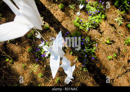 A garden of white orgami swans Stock Photo - Alamy