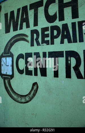 A hand painted watch and clock repair business sign made by an African ...