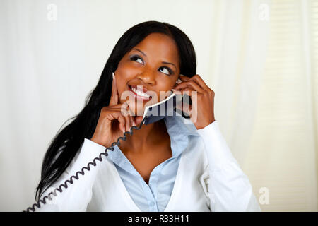 Photo of lovely lady hold telephone finger chin beaming smile wear ...