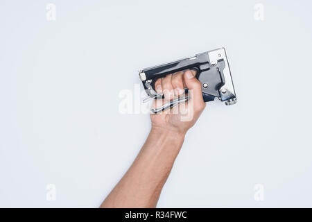 A male hand holding stapler, man hand isolated on white background High ...