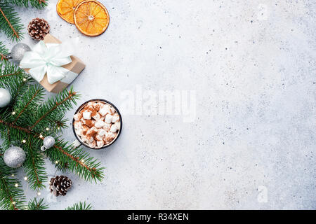 Cup with marshmallow and fir tree with snow. Christmas holiday with ...