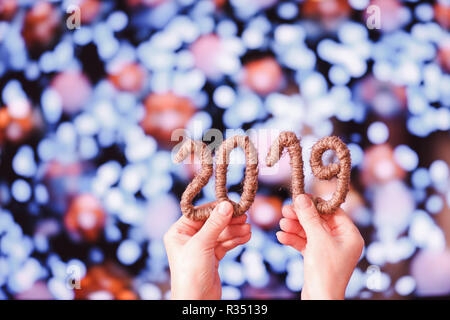 2019 numbers in hands and bokeh background. Christmas and happy new ...