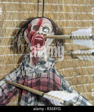 Frightening man with Halloween zombie bloody wounded makeup, trying to ...