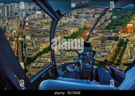 Helicopter cockpit flying on Paris Tour Eiffel tower skyline. Scenic ...