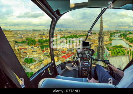 Helicopter cockpit flying on Parisian panorama aerial view of Paris ...