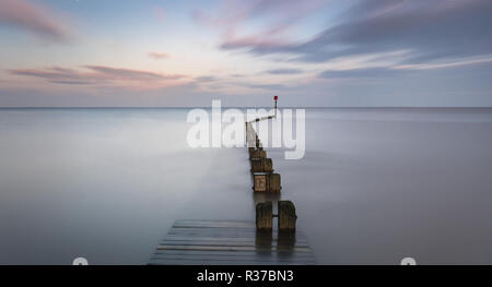 High tide marker & jetty at Cleethorpes beach Stock Photo - Alamy