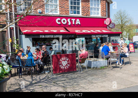 Costa coffee shop in Wilmslow, Customers are sitting outside eating and ...