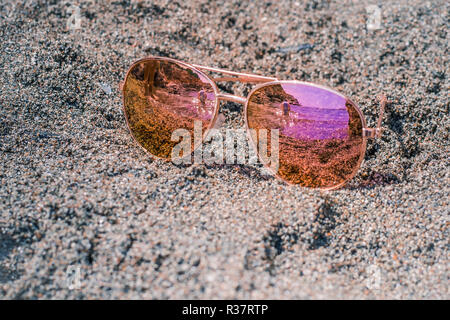 Sunglasses at the beach with beach ball reflection Stock Photo - Alamy