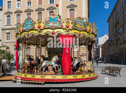 Colourful carousel on the street - Trieste, Italy Stock Photo - Alamy