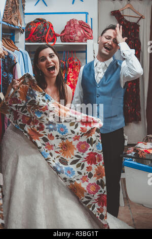 A young couple of choose and buy clothes Stock Photo - Alamy