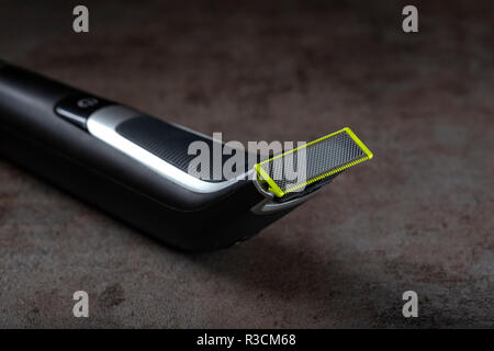 Electrical shaver on a dark background - close up view Stock Photo - Alamy