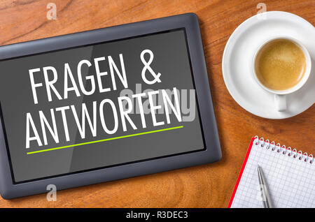 Tablet on a desk - Questions and Answers Stock Photo - Alamy