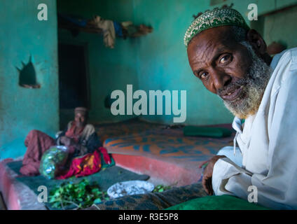 Men chewing khat inside their traditional house with decorated and ...