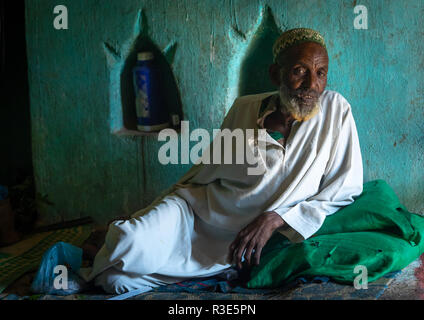 Harari man chewing khat inside an old house, Harari Region, Harar ...