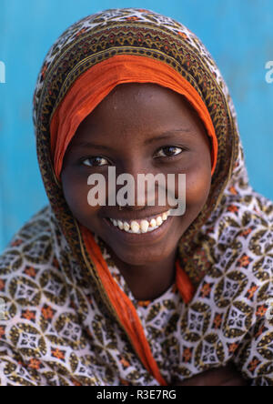 Portrait of a veiled smiling afar tribe girl with sharpened teeth, Afar ...