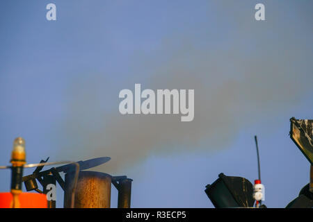Exhaust emissions, burning marine diesel in a ships engine. Marine ...