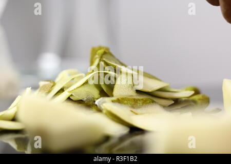 Pears skin on granite surface Stock Photo - Alamy