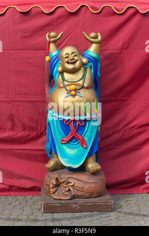 Laughing seated fat Buddhist monk Stock Photo: 54194015 - Alamy