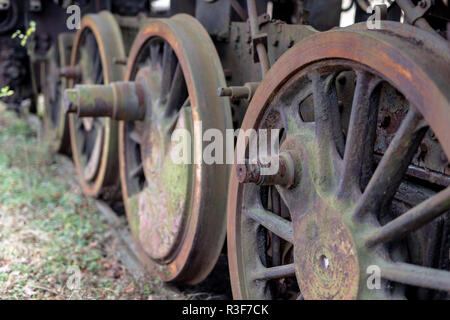 Old destroyed steam engines. Forgotten railway station in central ...
