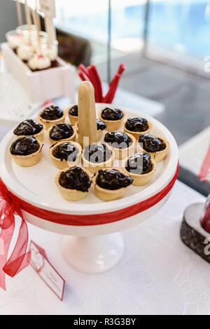 Composition with plate of tasty olives, bread and cheese on light ...