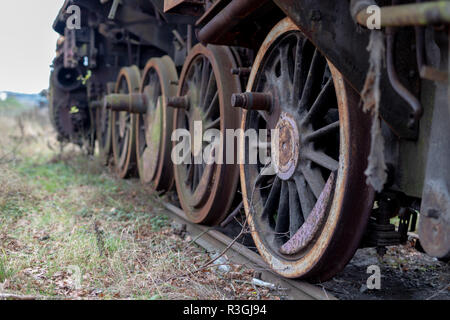 Old destroyed steam engines. Forgotten railway station in central ...
